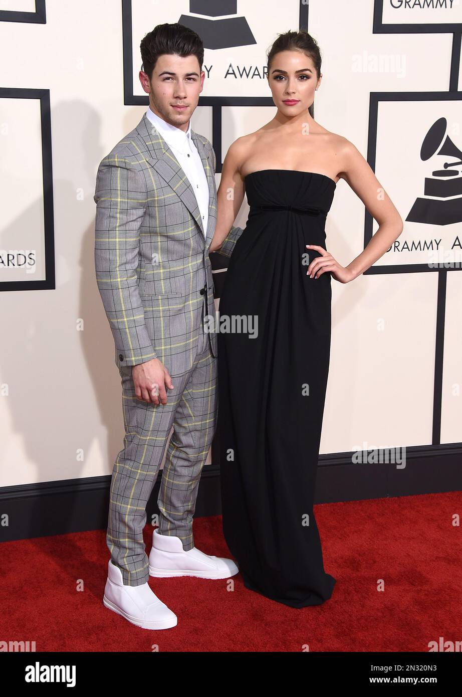 Nick Jonas, left, and Olivia Culpo arrive at the 57th annual Grammy Awards at the Staples Center ...