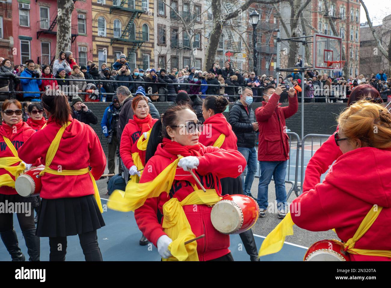 A group of people in colorful costumes in the street during the Chinese ...