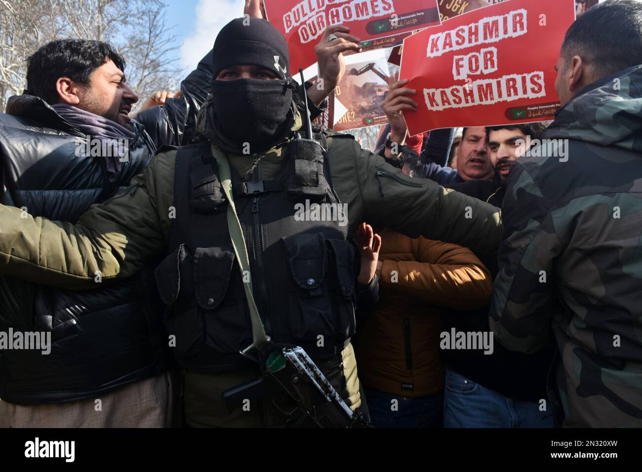 Srinagar, India. 07th Feb, 2023. A police officer stopped the members ...