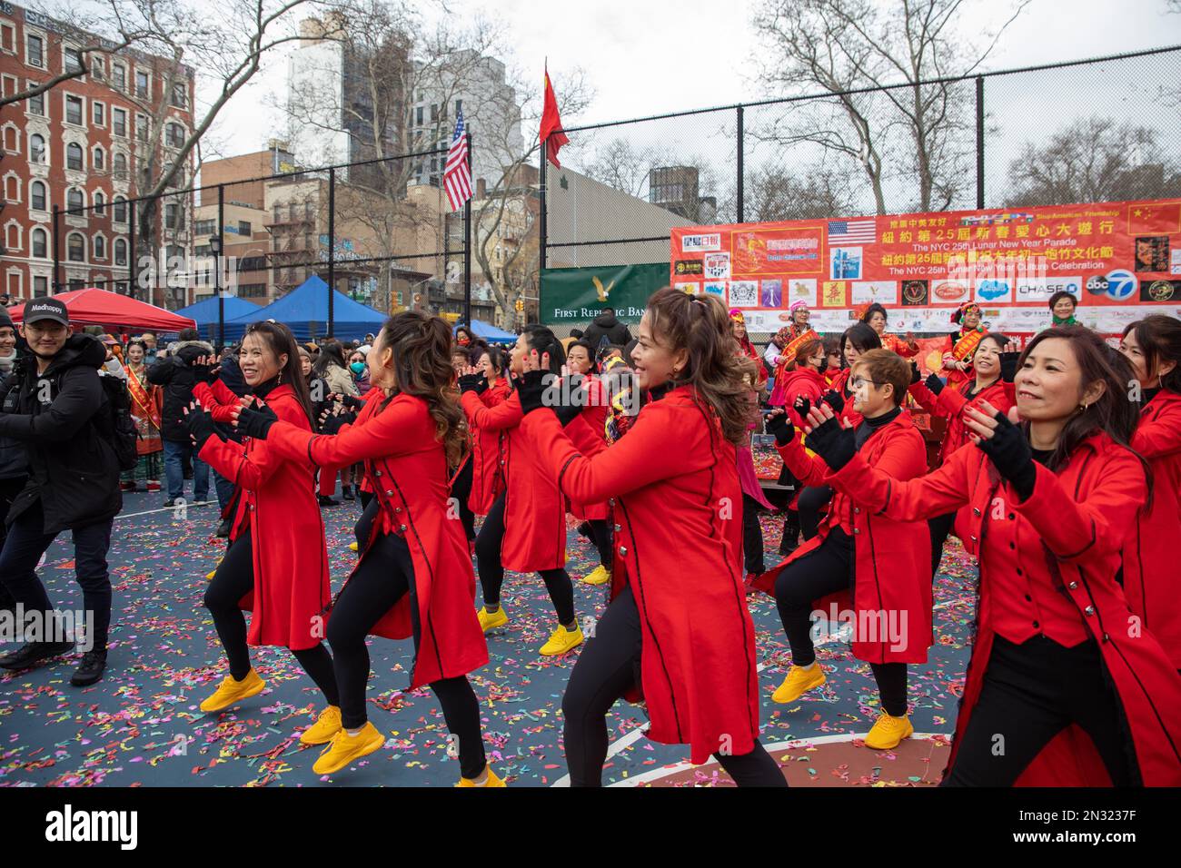 A group of people in colorful costumes in the street during the Chinese ...