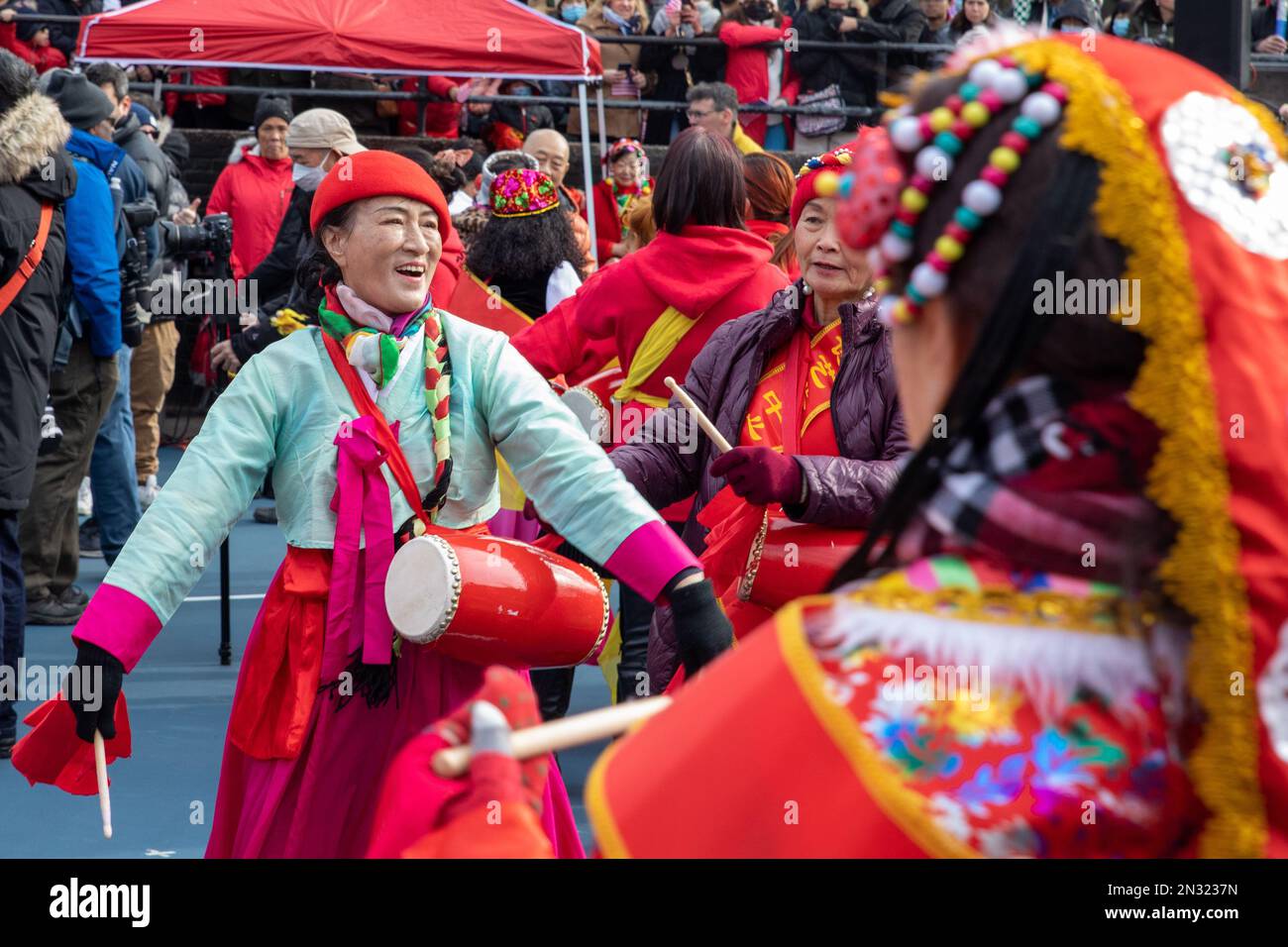 A group of people in colorful costumes in the street during the Chinese ...