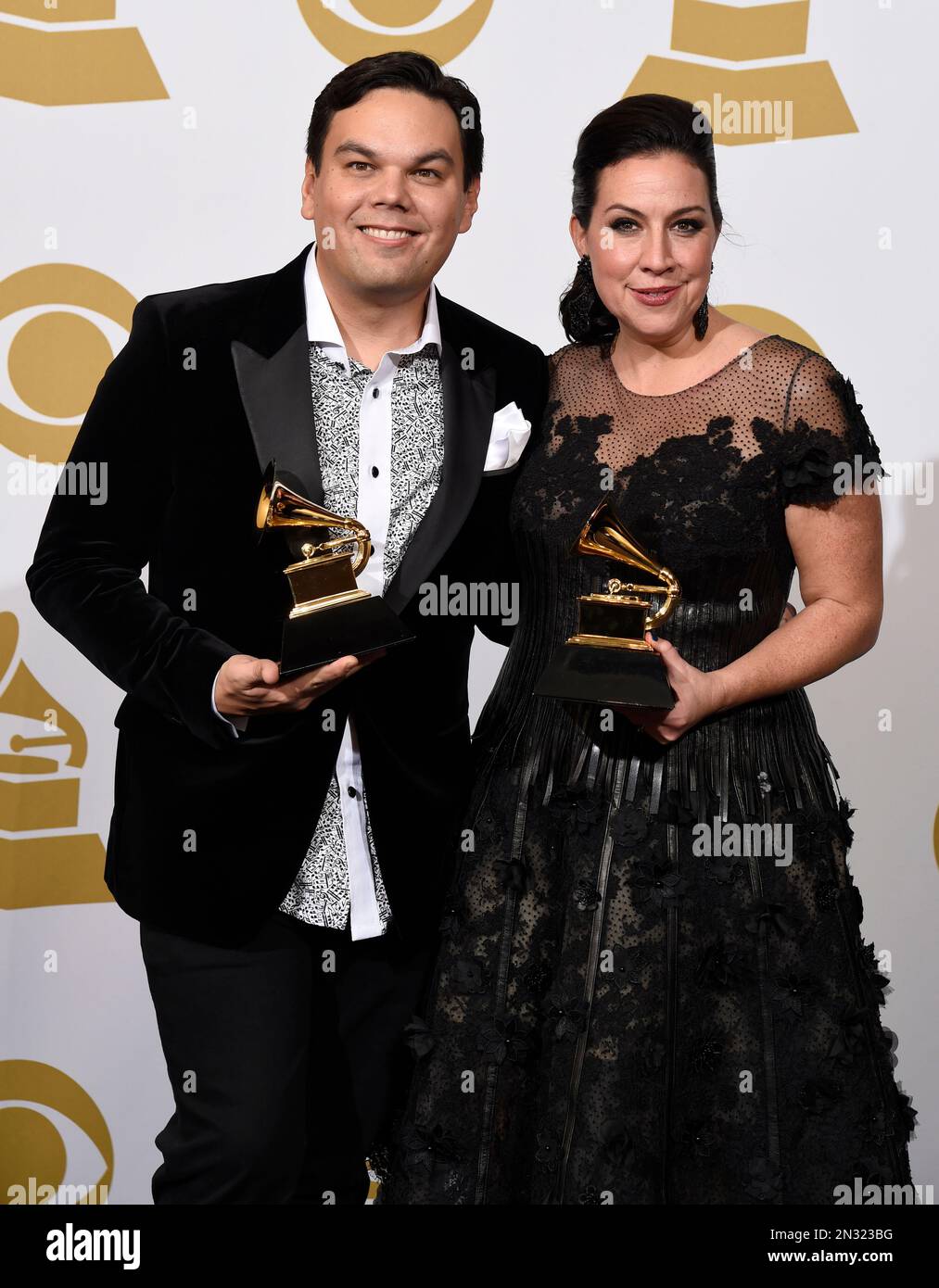 Kristen Anderson-Lopez, left, and Robert Lopez pose in the press room ...