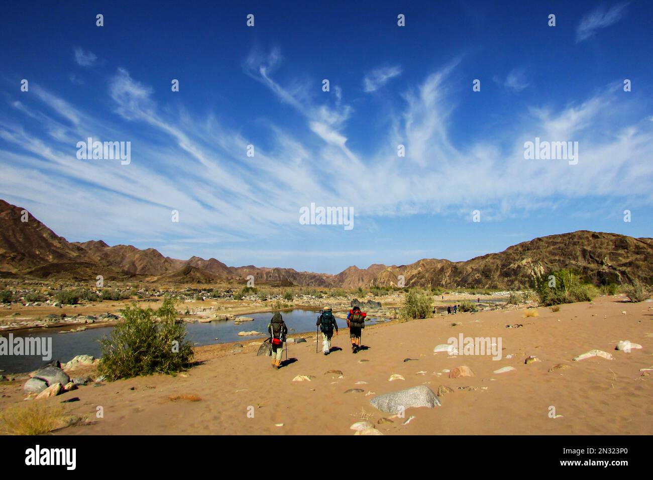 Hikers in a wide-open section of the Fish River Canyon in Namibia Stock ...