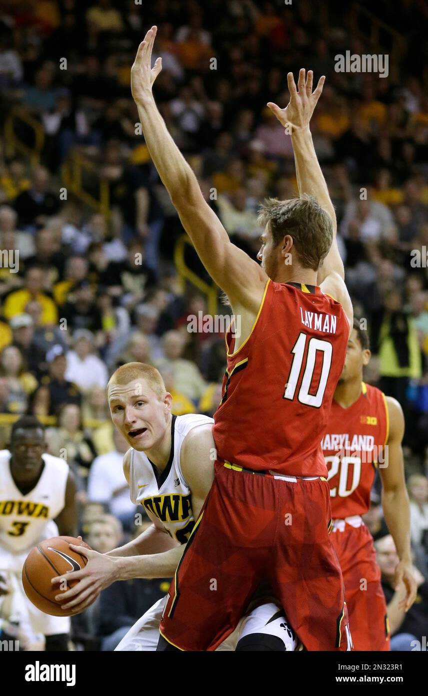 Iowa forward Aaron White, left, looks to drive around Maryland forward ...