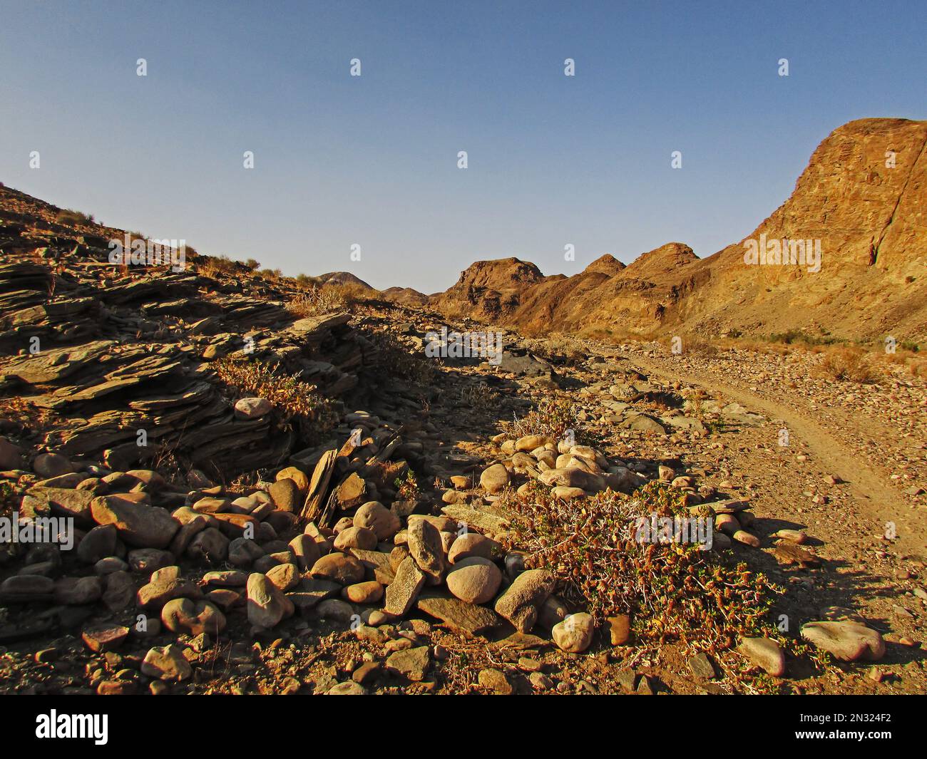 A trail through the barren rock-strewn landscape at the end of the Fish ...