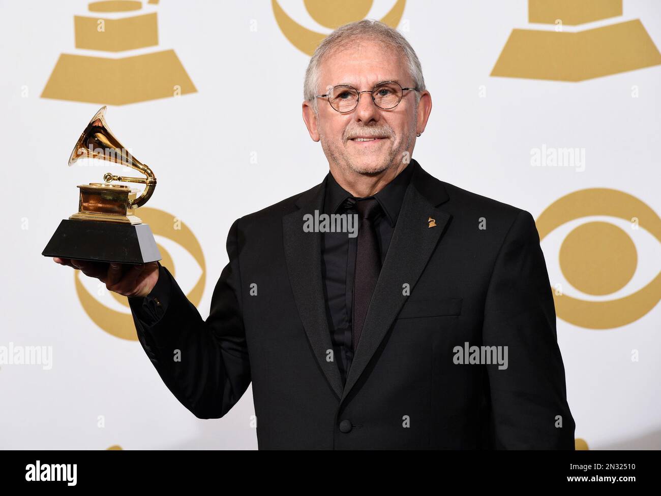 Elliot Scheiner poses in the press room with the award for best ...