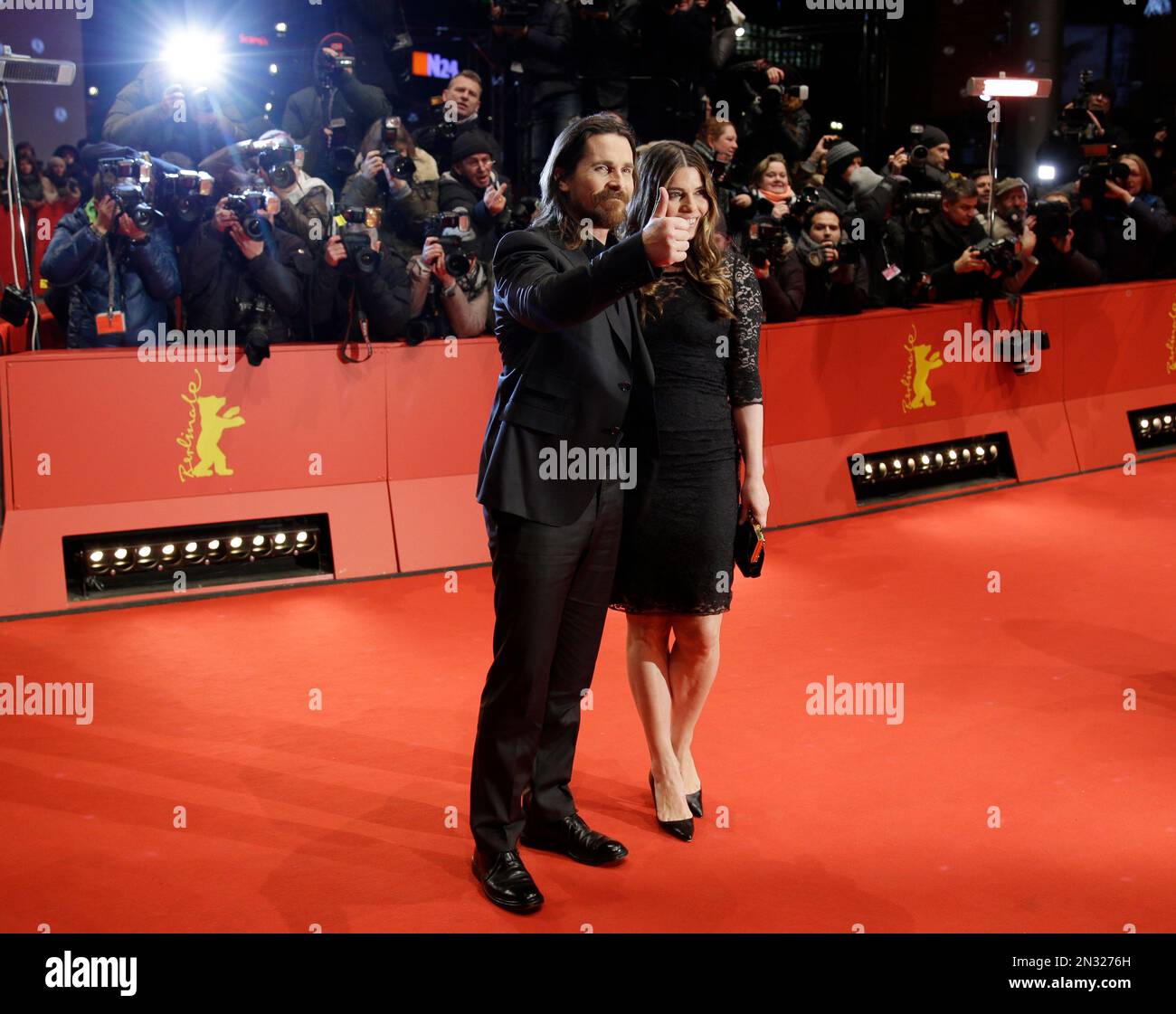 Actor Christian Bale, left, gives thumb-up as he and his wife Sibi ...