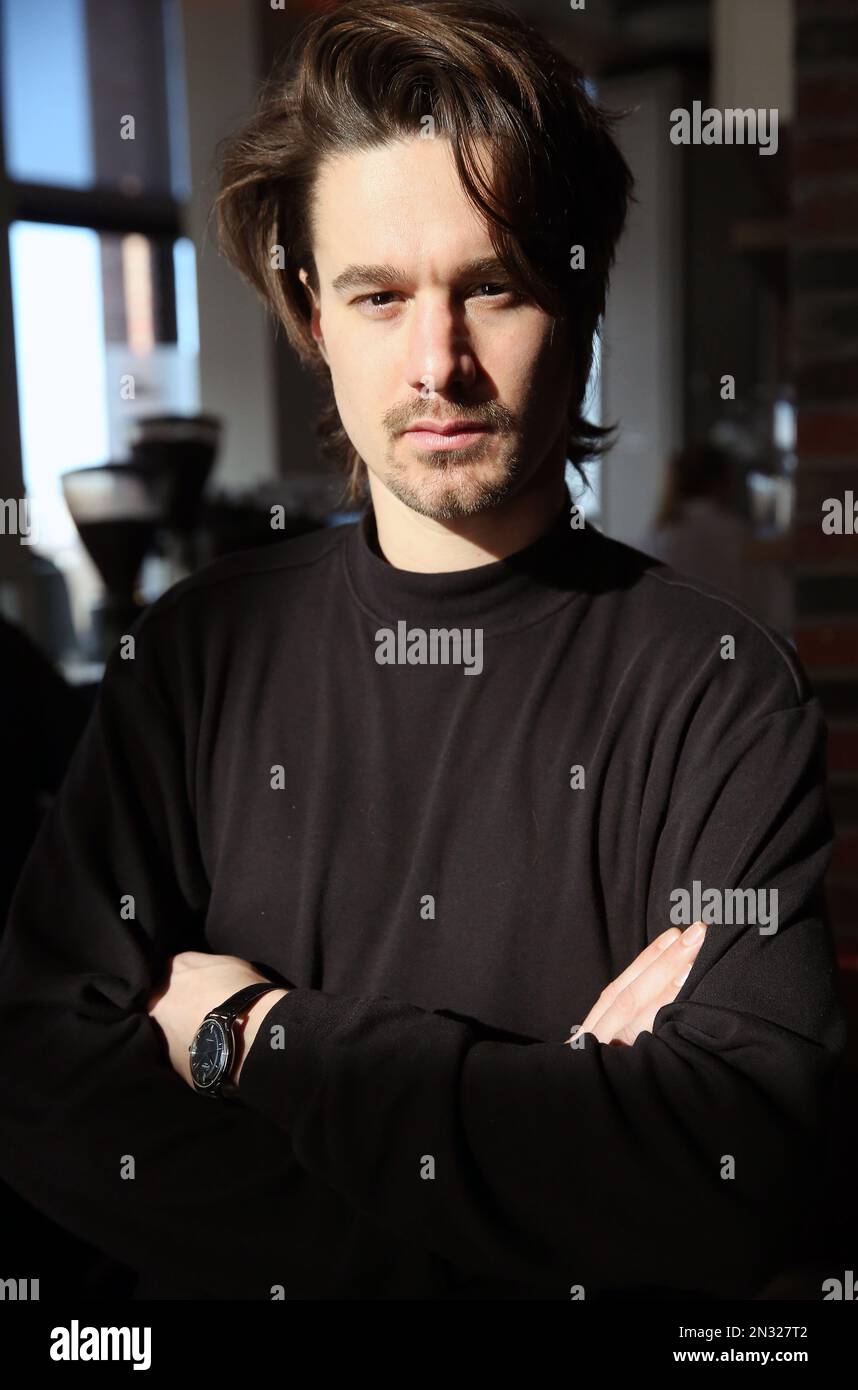 Director Sam de Jong is photographed with a Glashütte watch in the ...