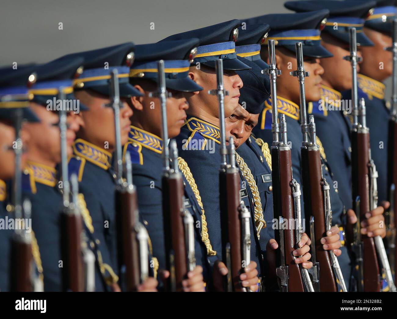 A Filipino trooper inspects the alignment of a guard of honor during ...