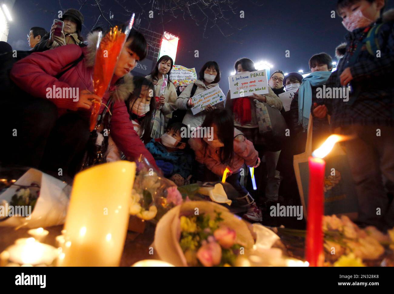 People gather to mourn two Japanese hostages, Kenji Goto and Haruna ...