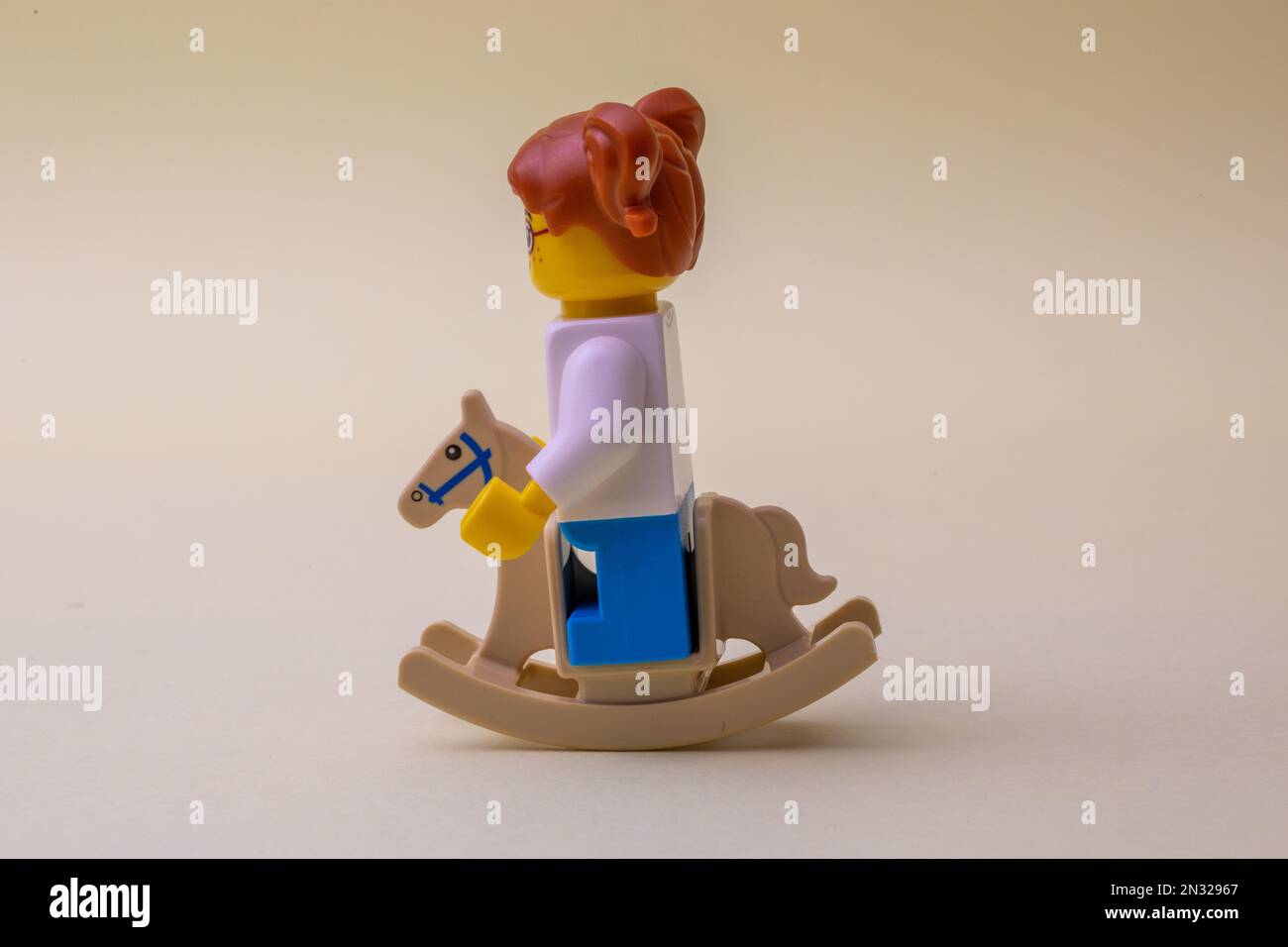 A LEGO minifigure toy sitting on a gorse on pastel background Stock ...