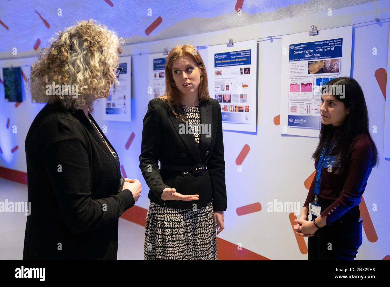 Princess Beatrice speaks to researchers during a visit to the the ...