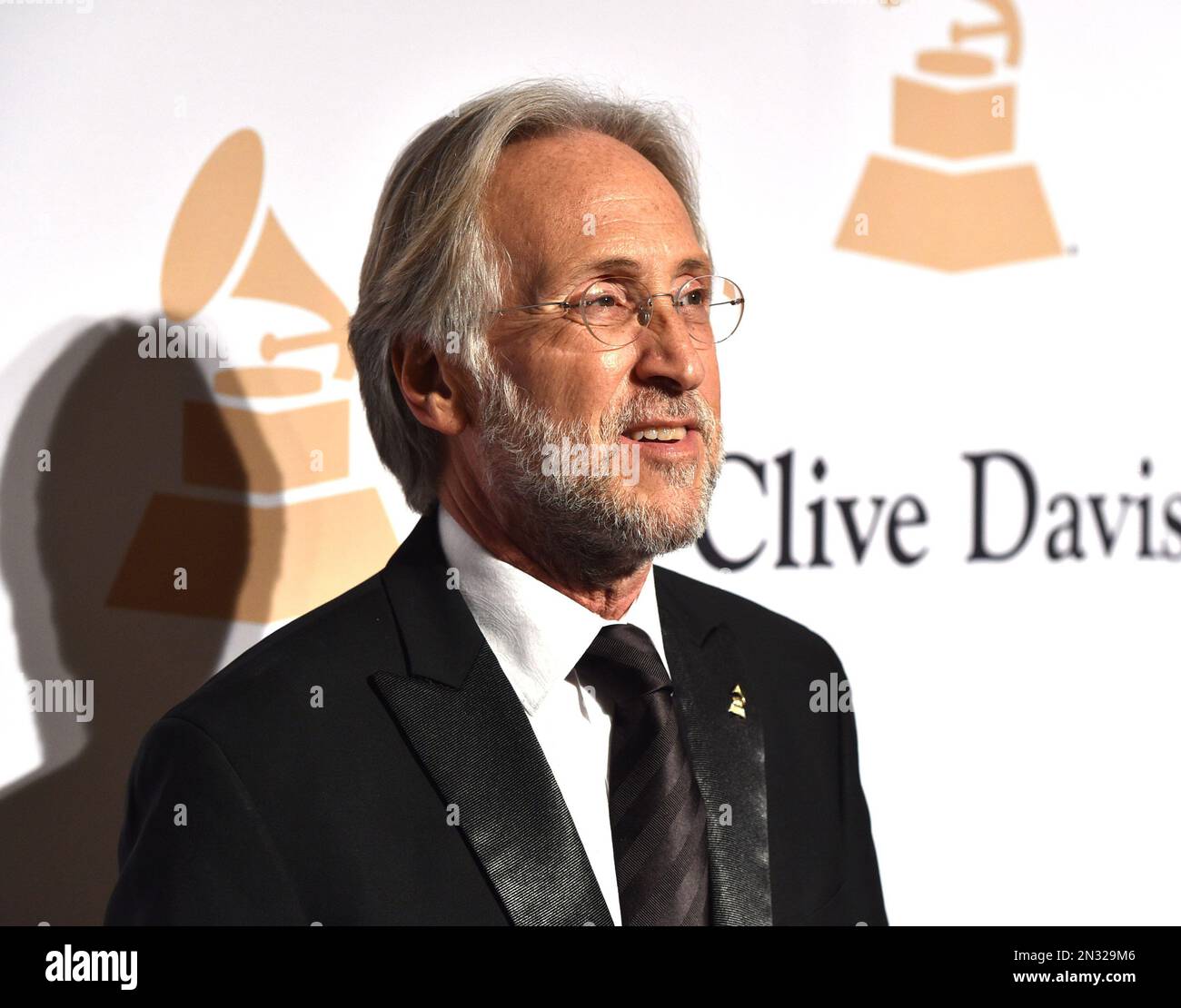 Neil Portnow arrives at the 2015 Clive Davis Pre-Grammy Gala at the ...