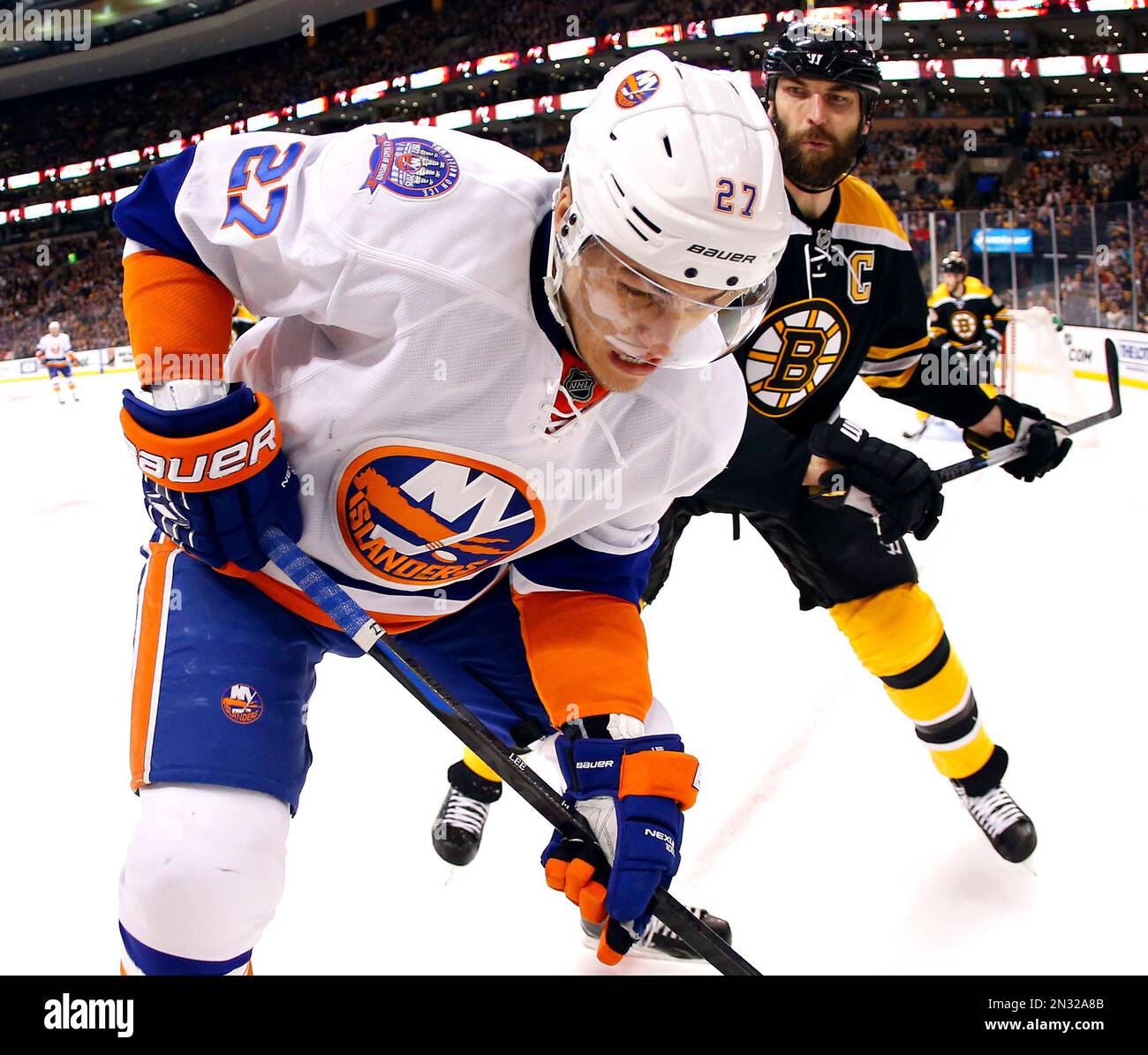 Boston Bruins defenseman Zdeno Chara moves in to check New York ...