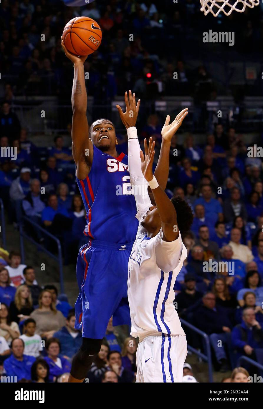 SMU center Yanick Moreira (2) shoots over Tulsa guard Rashad Smith (1 ...