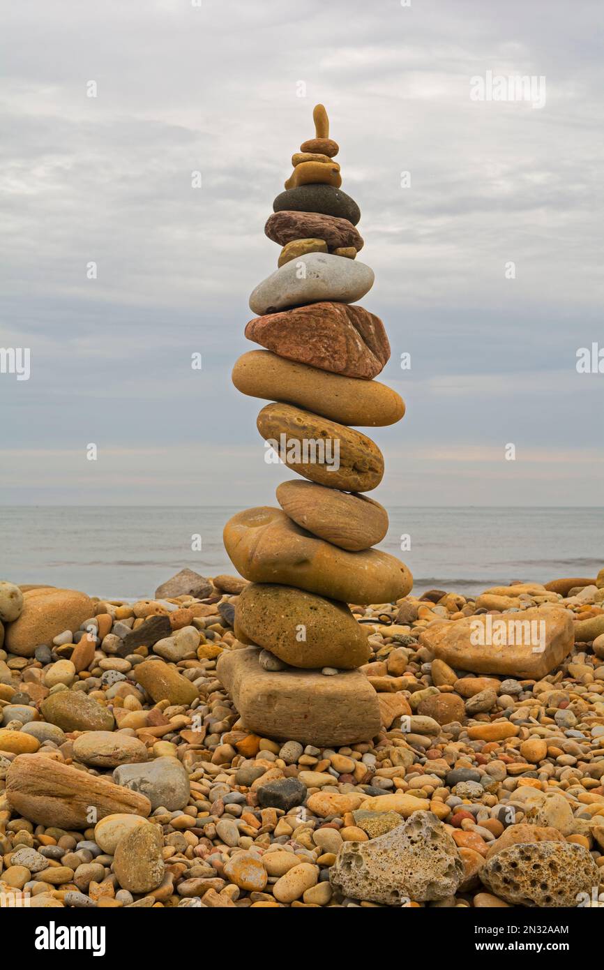 Balancing stones on the beach Stock Photo - Alamy