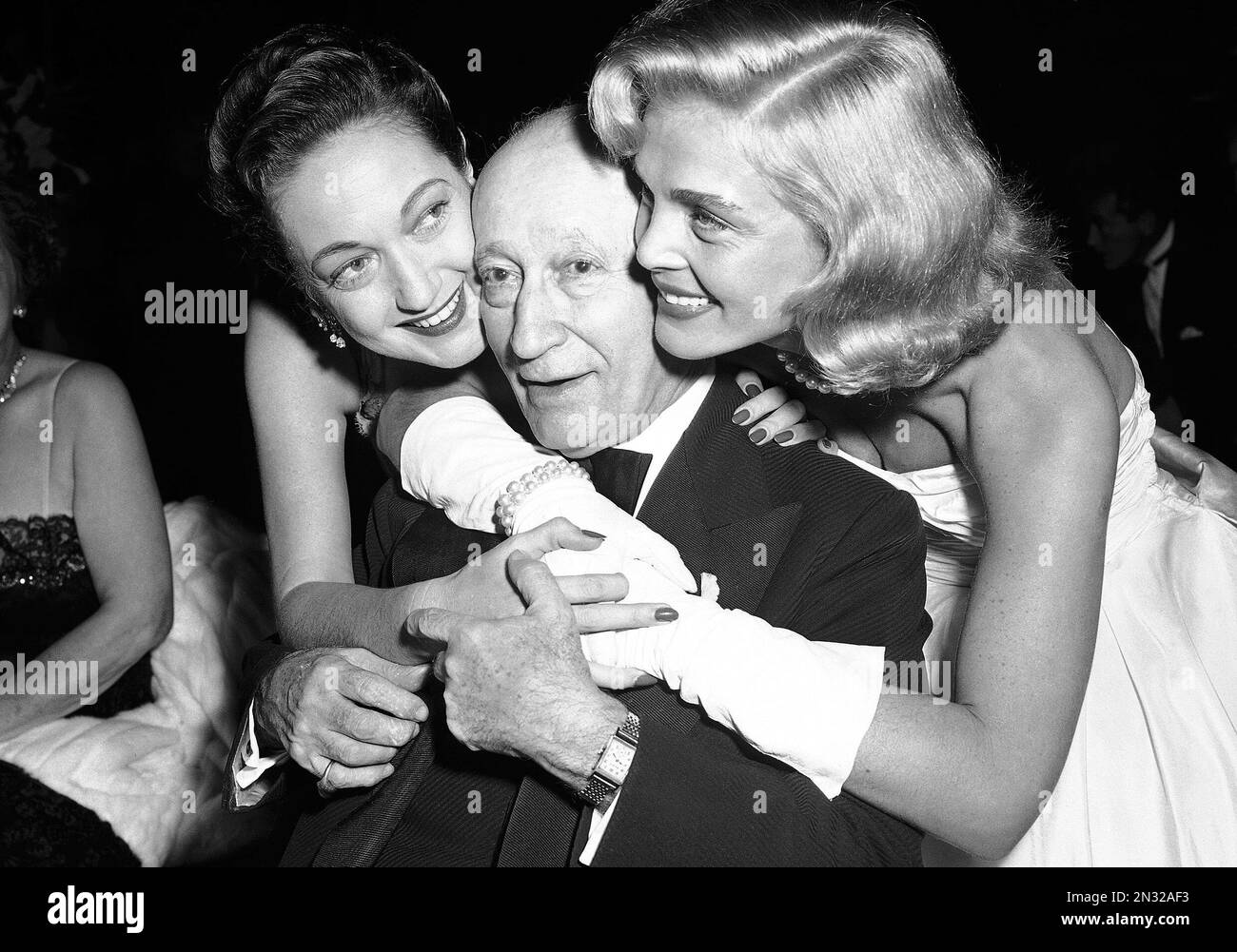 File-In this Jan. 7, 1953 file photo, Adolph Zukor, gets birthday hugs ...