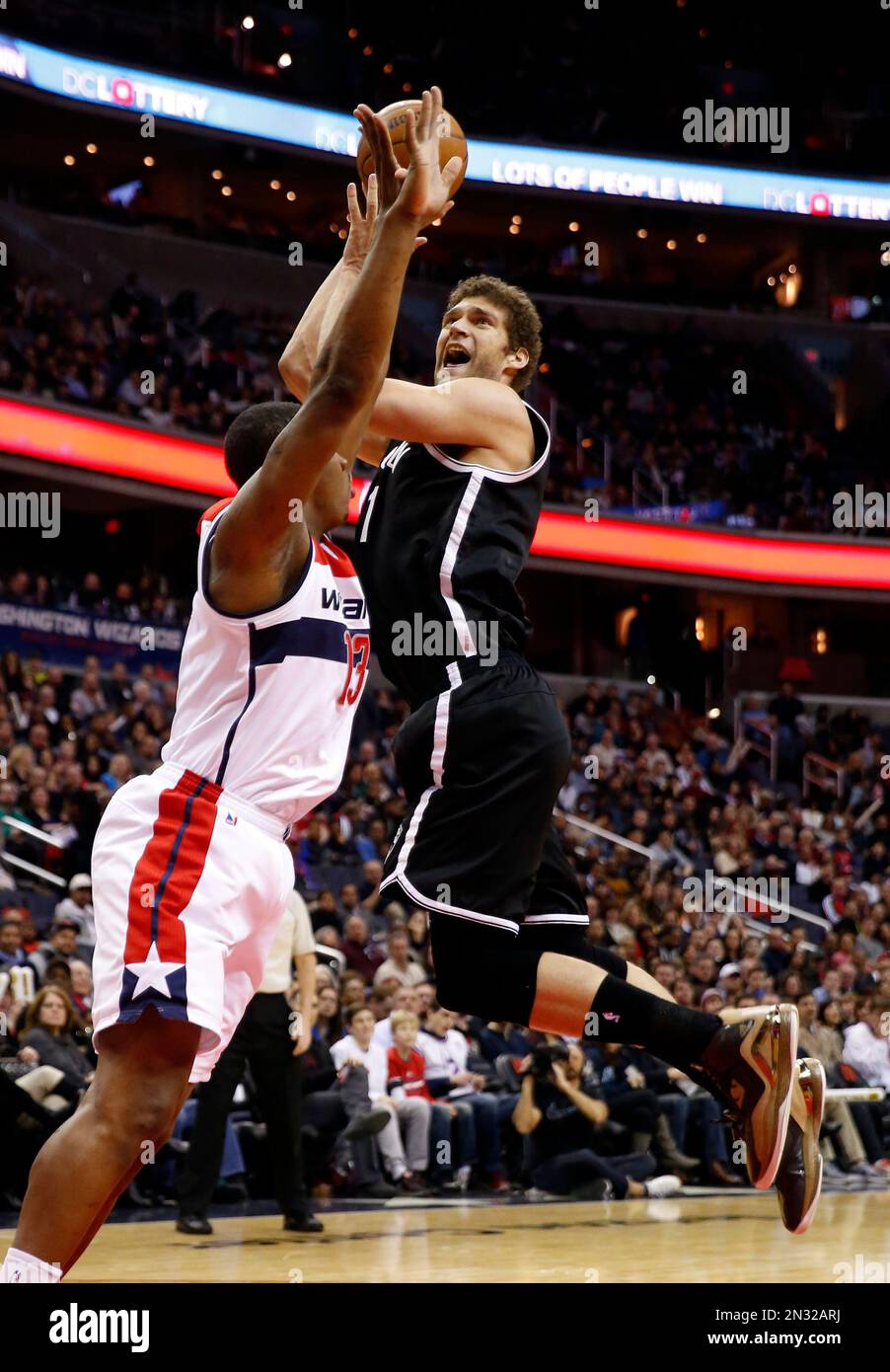 Brooklyn Nets center Brook Lopez (11) tries to shoot over Washington ...