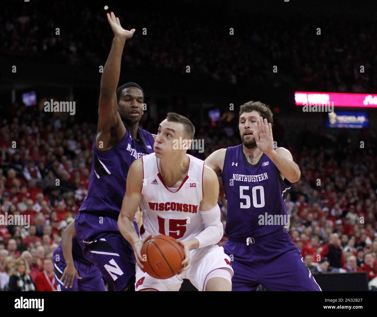 Wisconsin's Sam Dekker (15) battles against Northwestern's Vic Law ...