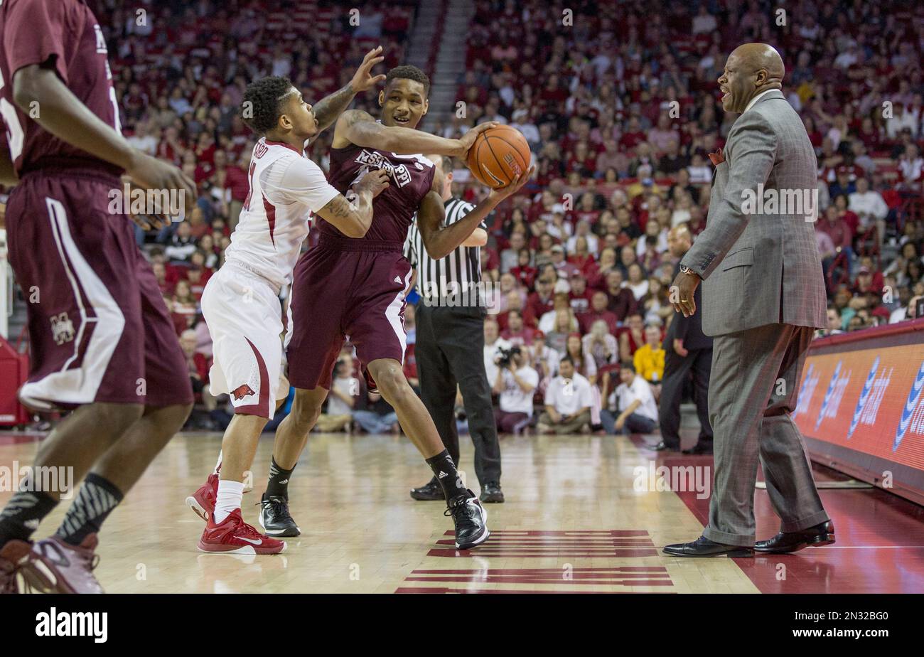 Mississippi State guard Demetrius Houston, center, looks to pass as he ...