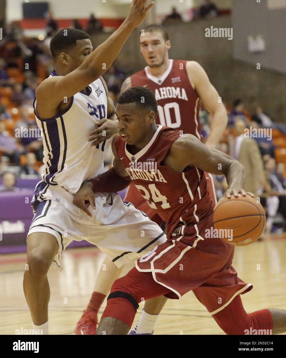 Oklahoma guard Buddy Hield (24) drives against TCU forward Brandon ...