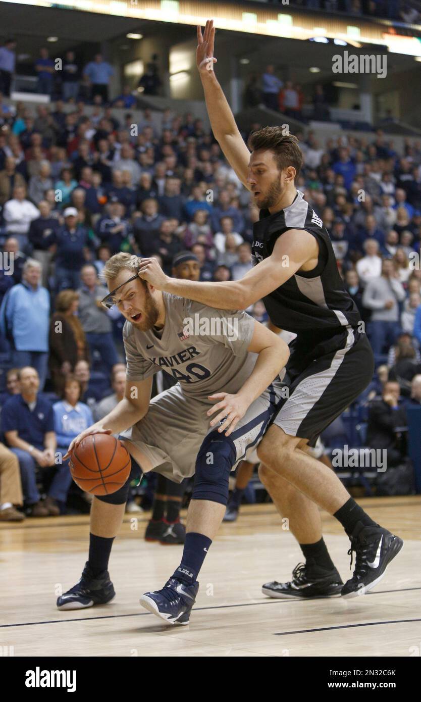 Xavier center Matt Stainbrook (40) drives against Providence forward ...