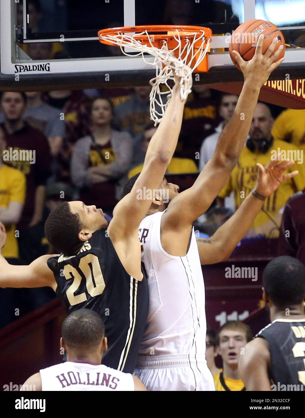 Minnesota’s Maurice Walker, right, shoots as Purdue’s Kendall Stephens ...