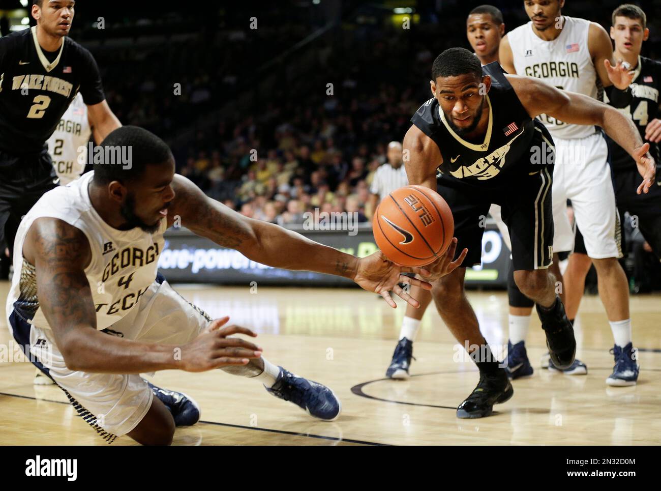 Georgia Tech's Demarco Cox, left, falls to the floor while chasing a ...