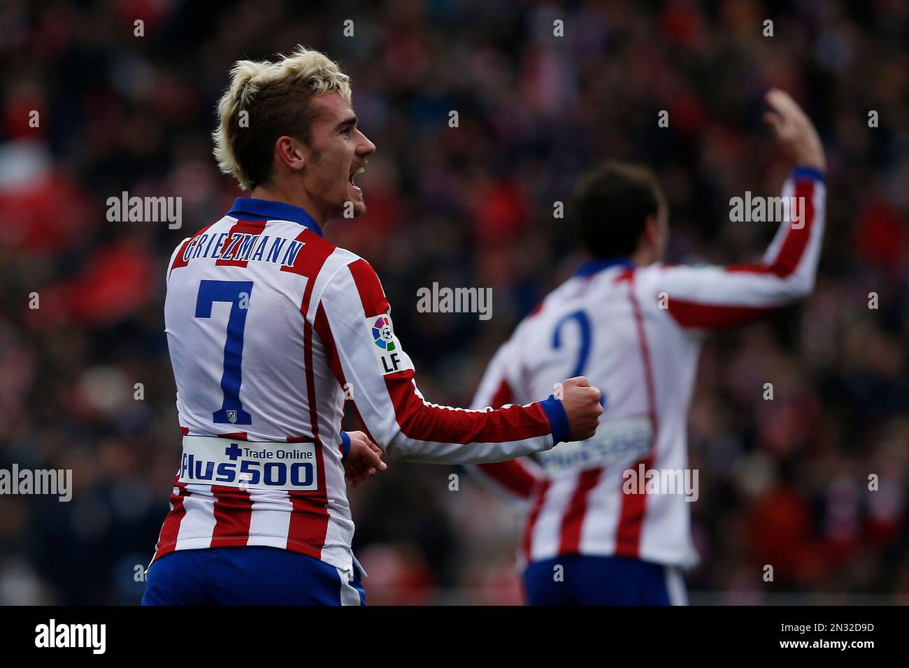 Atletico's Antoine Griezmann, centre, celebrates his goal during a ...