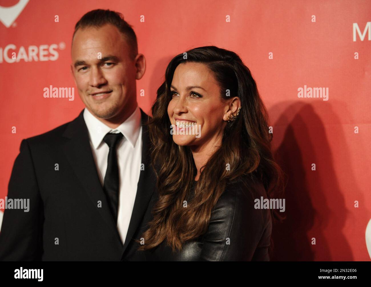 Alanis Morissette, right, and Mario Treadway arrive at the 2015 ...