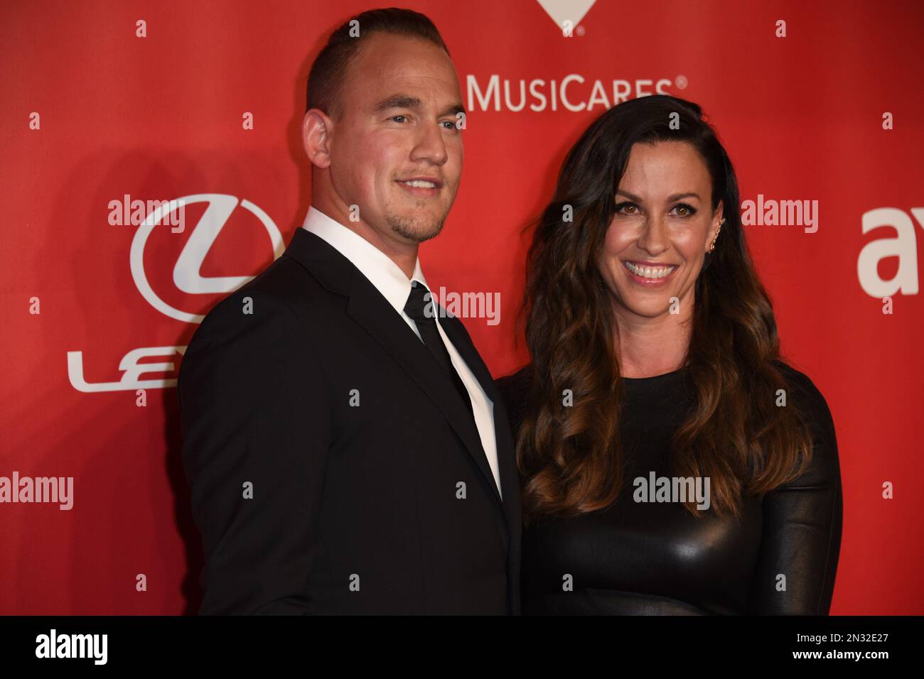 Alanis Morissette, right, and Mario Treadway arrive at the 2015 ...