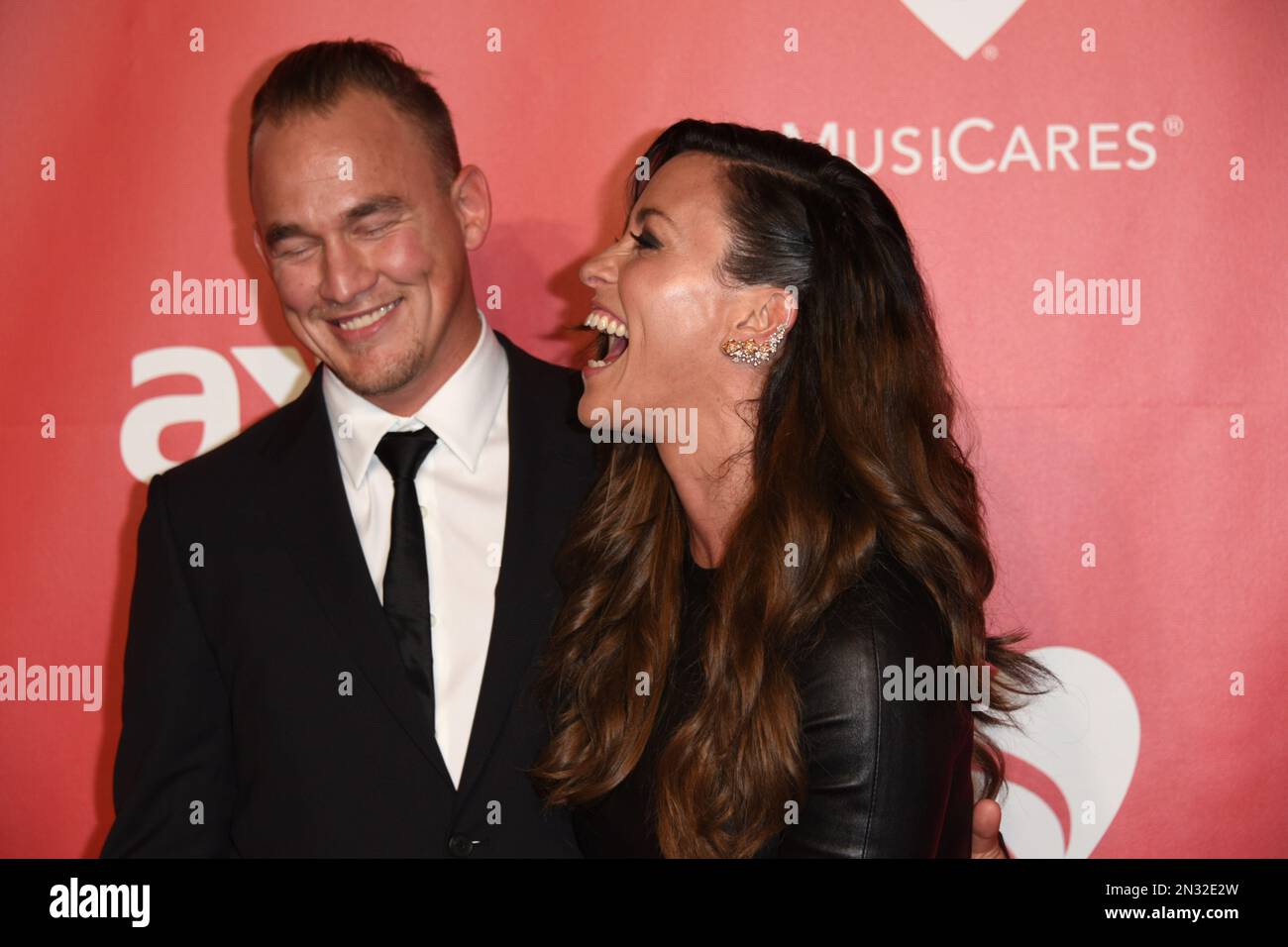 Alanis Morissette, right, and Mario Treadway arrive at the 2015 ...