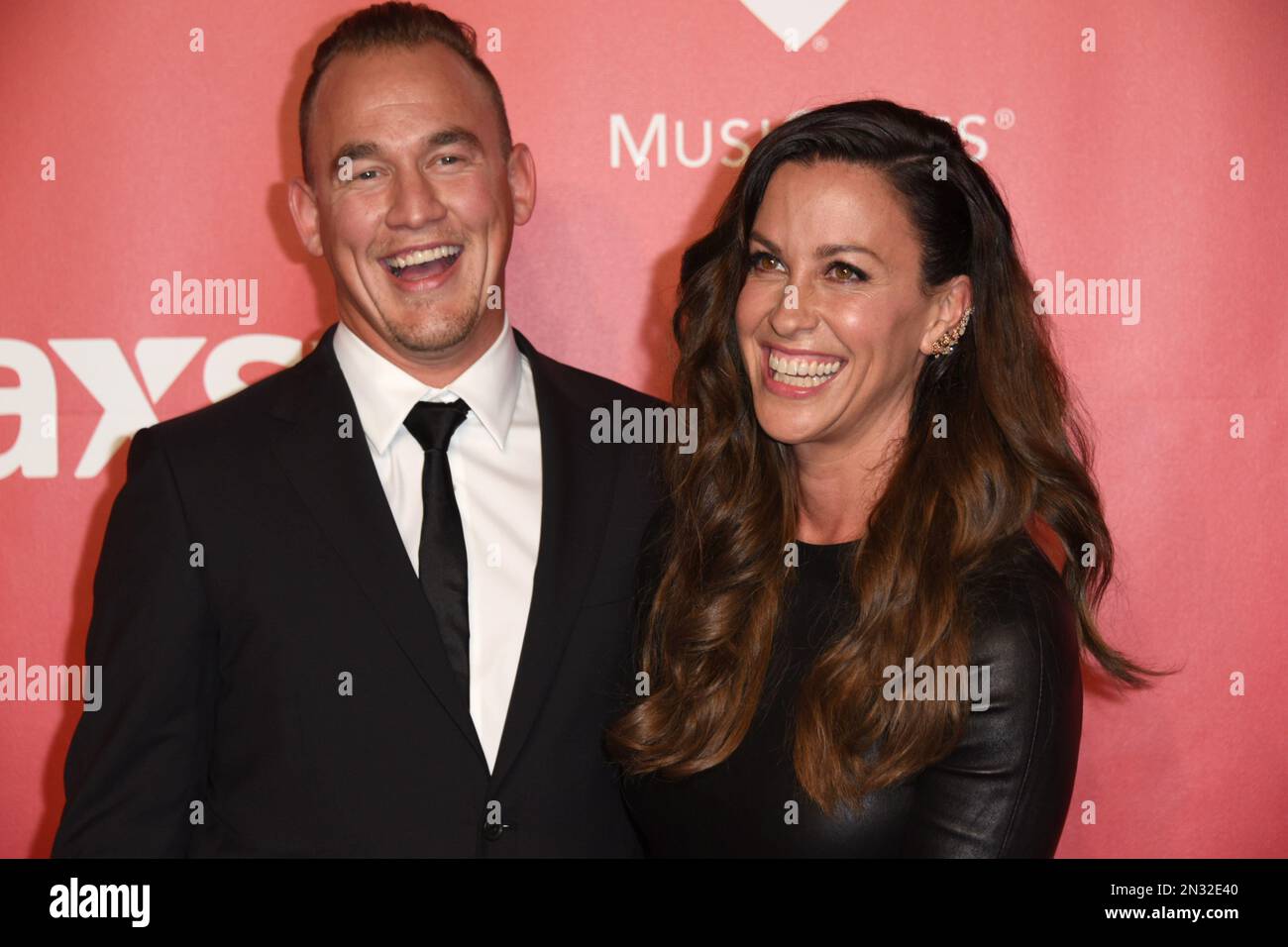 Alanis Morissette, right, and Mario Treadway arrive at the 2015 ...