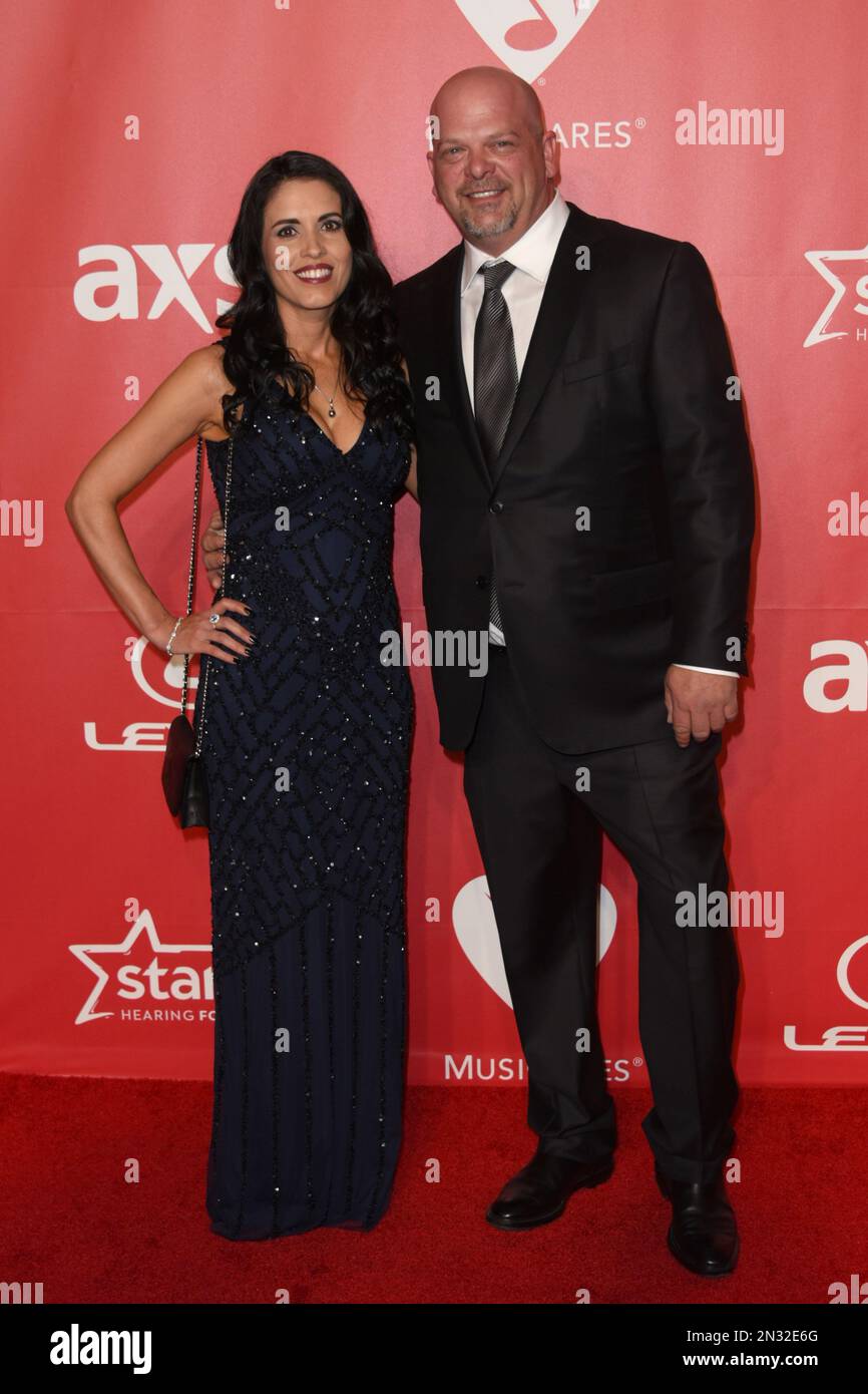 Rick Harrison, right, and DeAnna Burditt arrive at the 2015 MusiCares ...