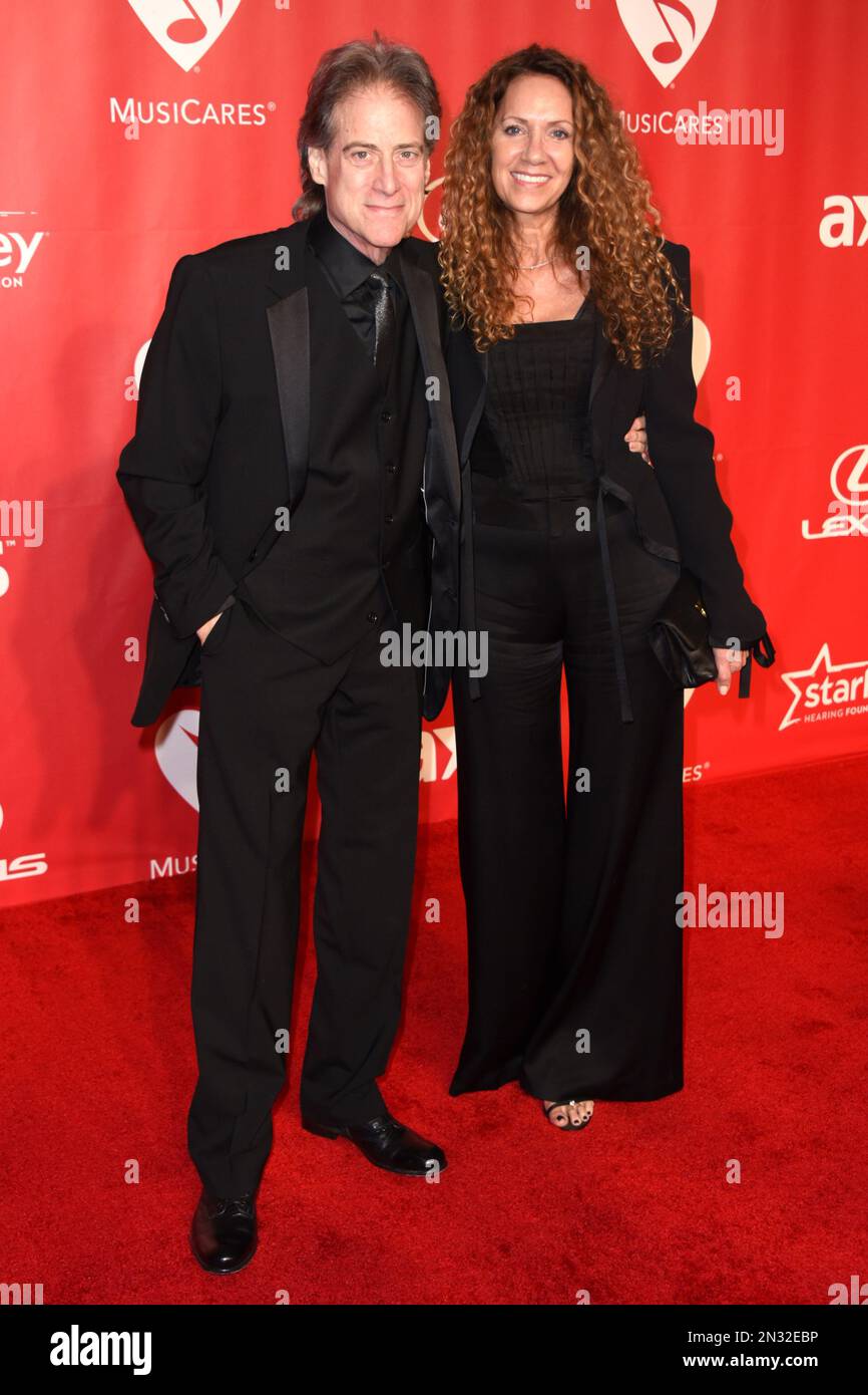 Richard Lewis, left, and Joyce Lapinsky arrive at the 2015 MusiCares ...