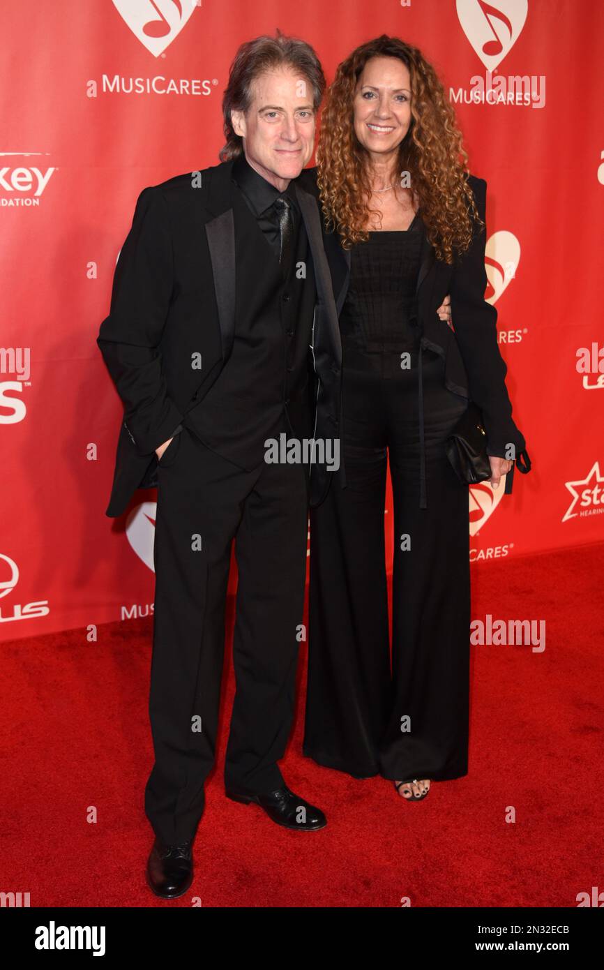Richard Lewis, left, and Joyce Lapinsky arrive at the 2015 MusiCares ...