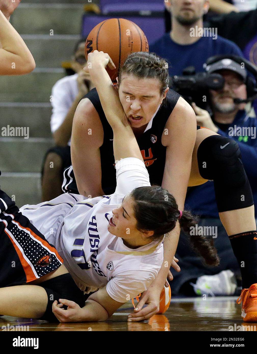 Washington's Kelsey Plum, bottom, and Oregon State's Ruth Hamblin ...