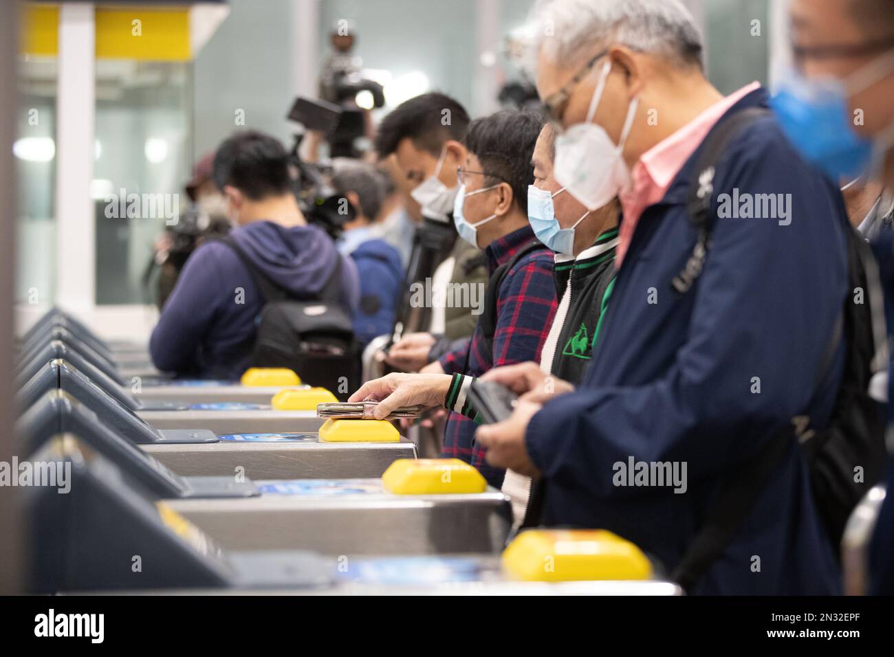 Travelers wait for the gate to open at Lo Wu Control Point on the first ...