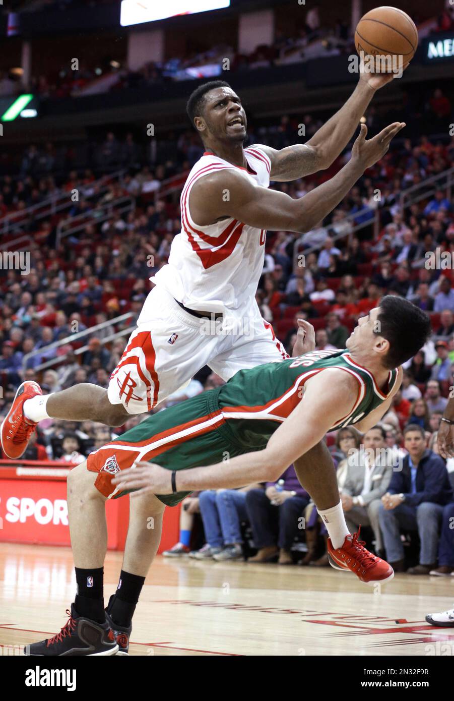 Houston Rockets' Terrence Jones, left, knocks down Milwaukee Bucks ...