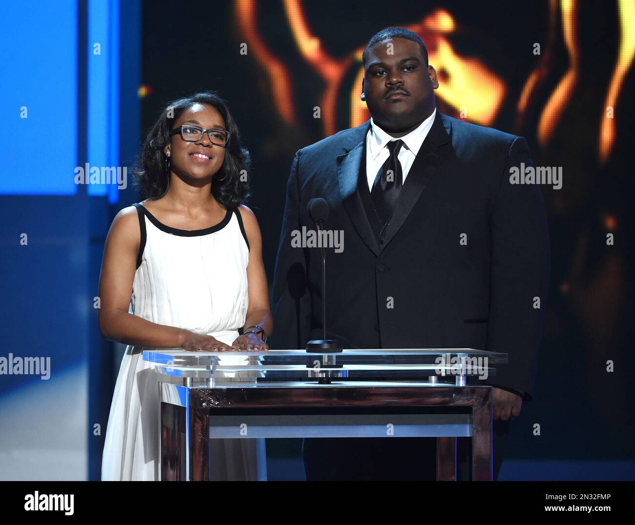 Valeska Gutierrez, left, and John Gaskin III present the Vanguard Award ...