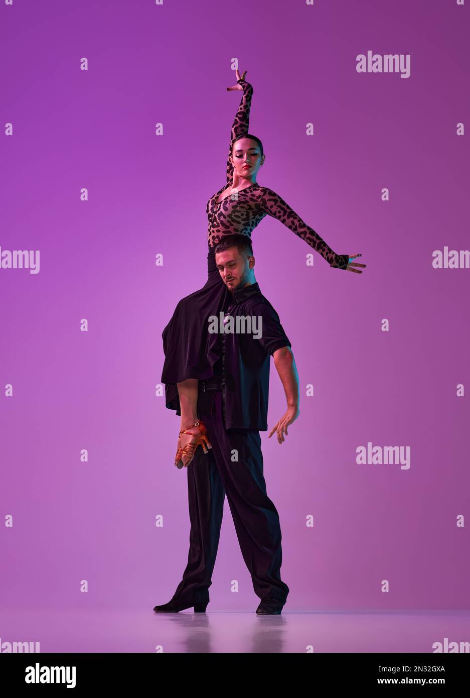 Man and woman, professional tango, ballroom dancers in stylish ...