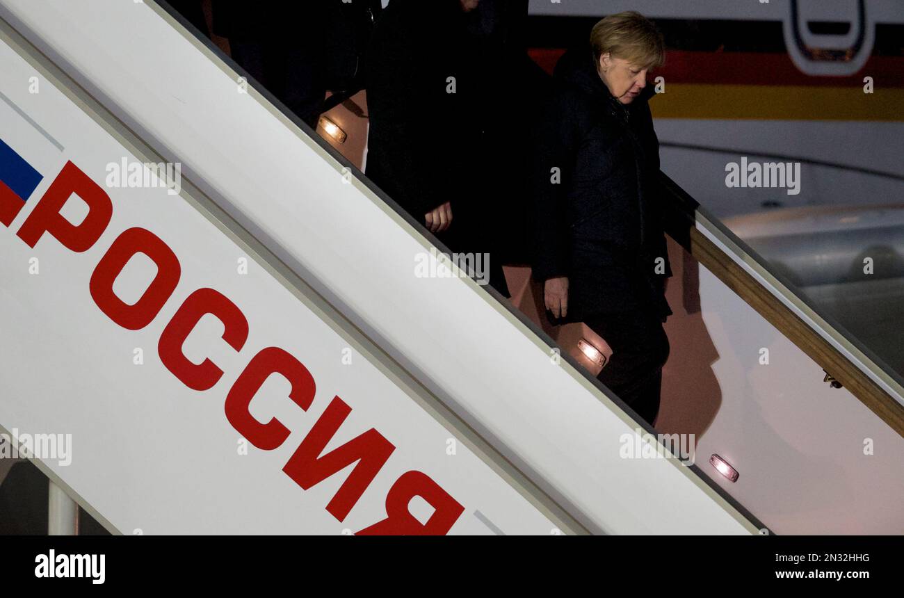 German Chancellor Angela Merkel leaves a plane upon her arrival at ...