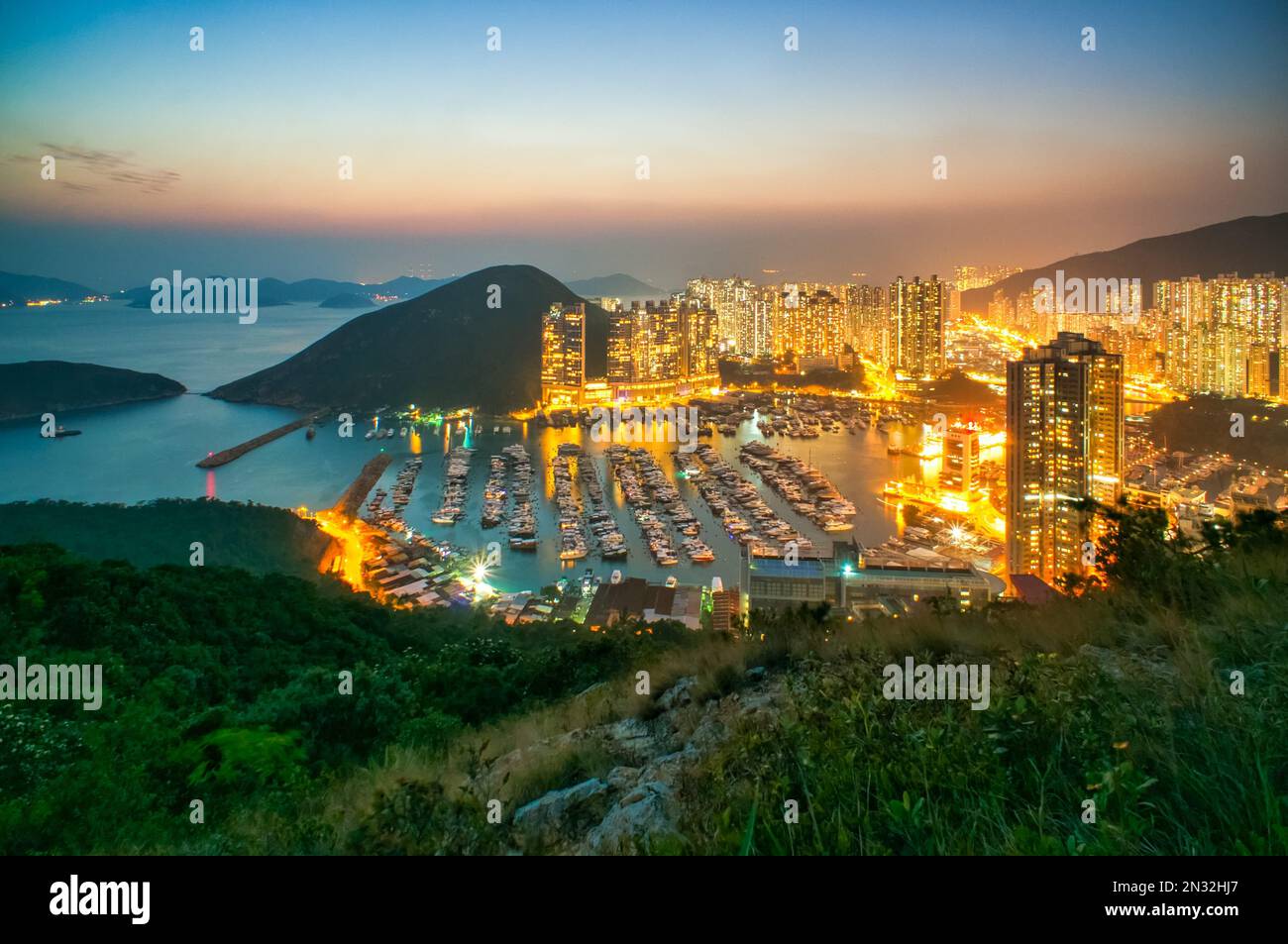 An aerial view of Aberdeen Harbour surrounded by buildings in Hong Kong ...