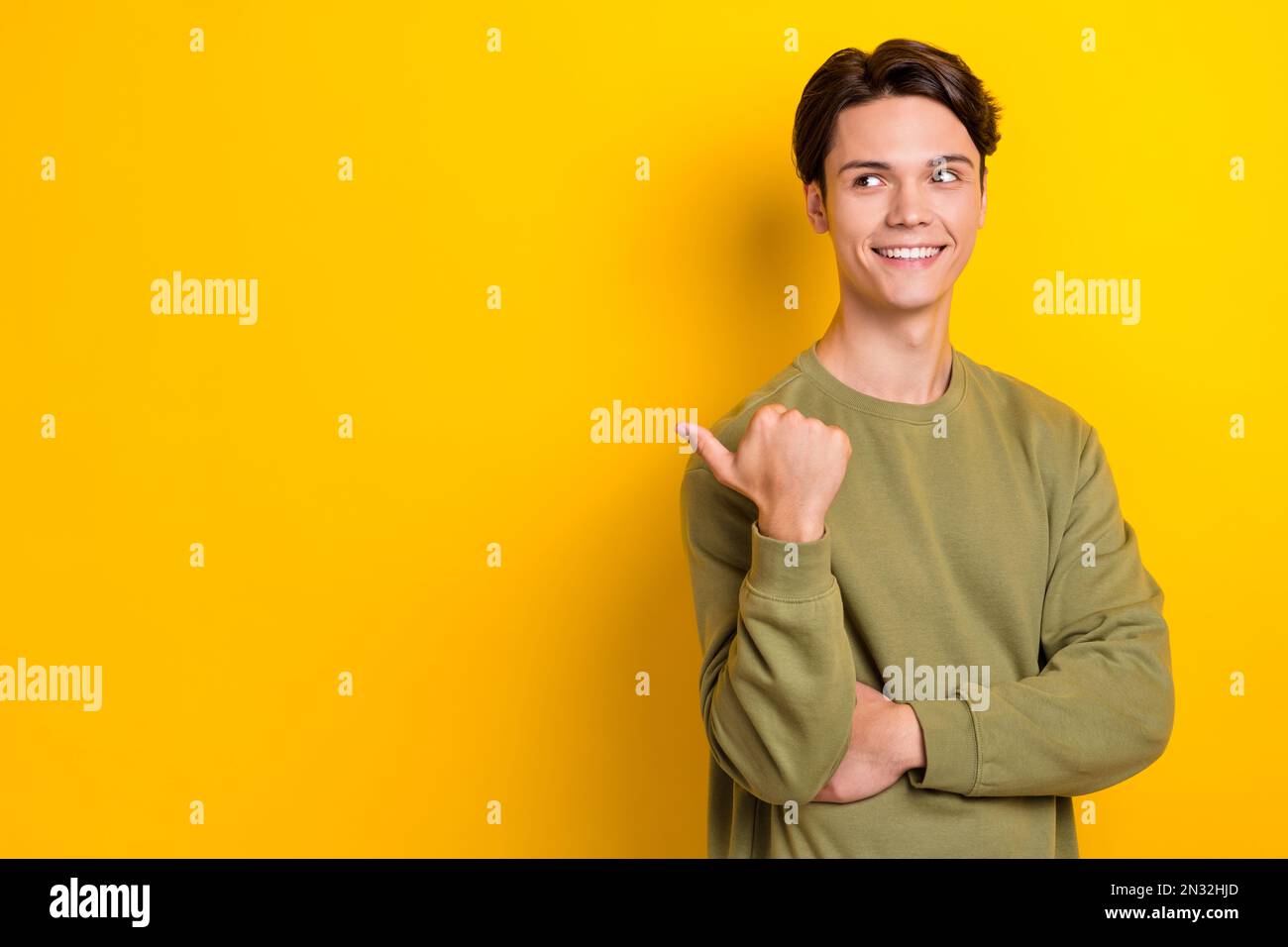 Photo of cheerful nice person toothy smile look indicate finger empty ...