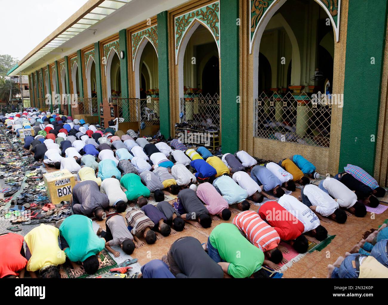 Filipino Muslims attend Friday prayers at the Golden Mosque Friday, Feb ...