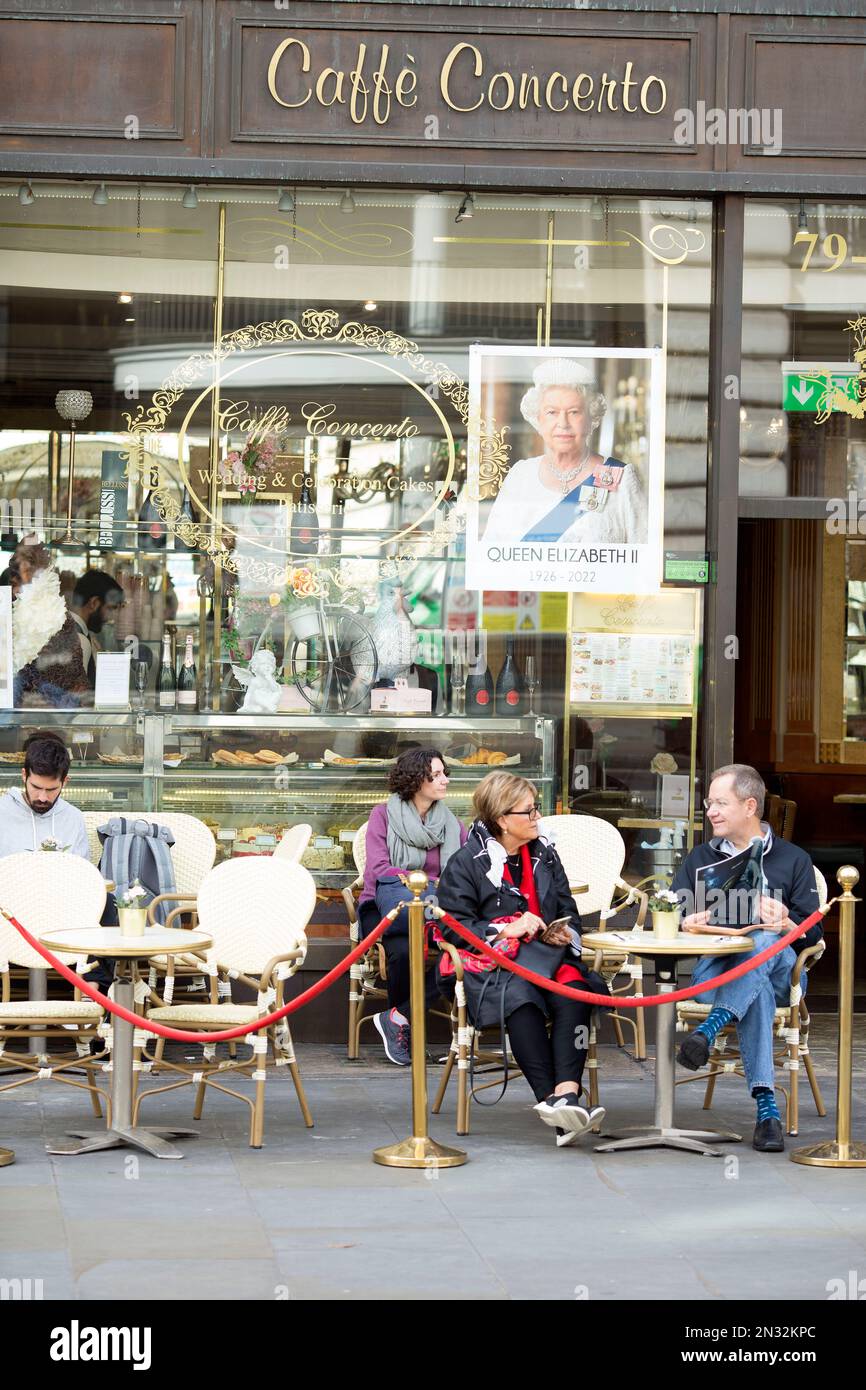 A portrait of Queen Elizabeth II is displayed in a shop window in ...