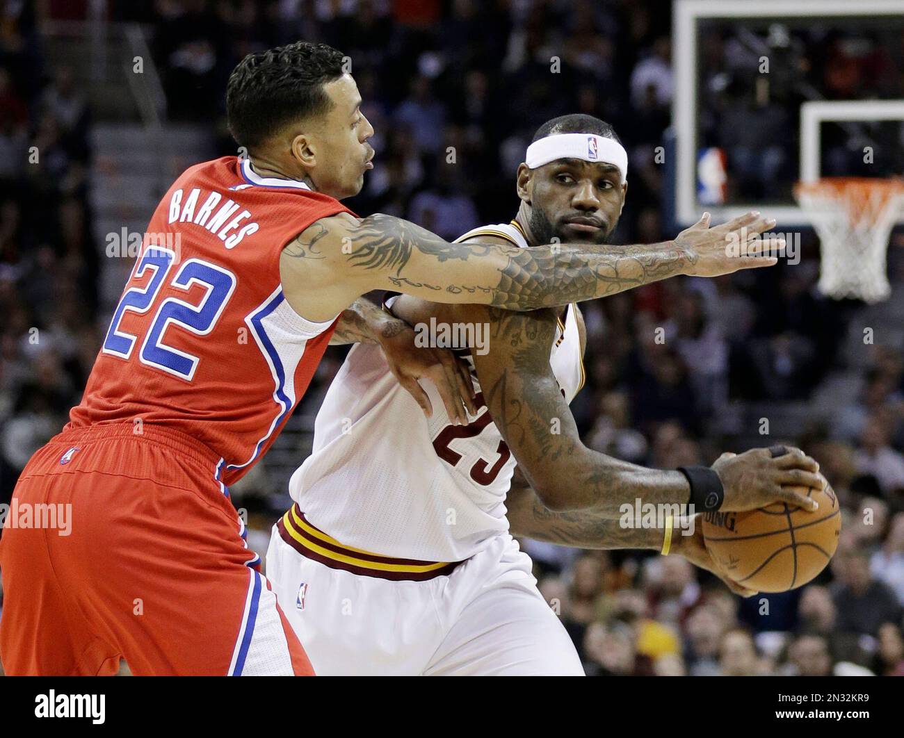 Cleveland Cavaliers' LeBron James (23) looks for a teammate under ...