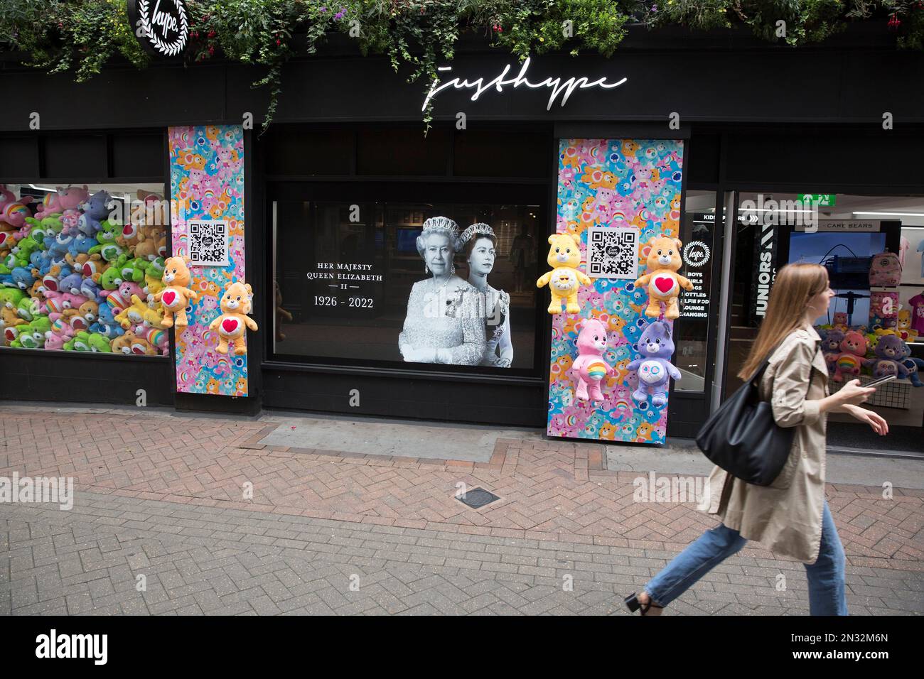 Portraits of Queen Elizabeth II are displayed in a shop window in ...