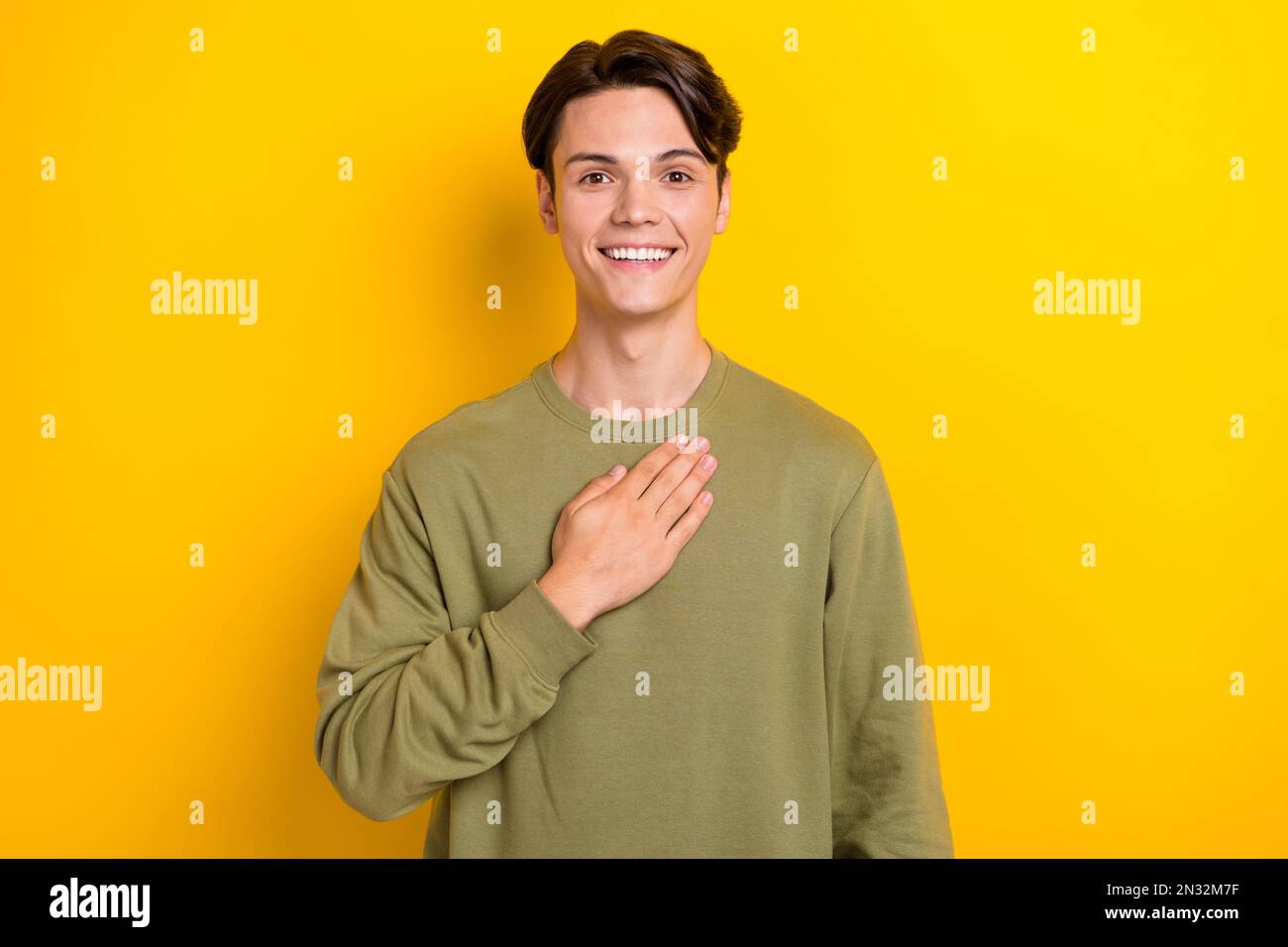 Photo of cheerful fascinated person beaming smile arm touch chest ...