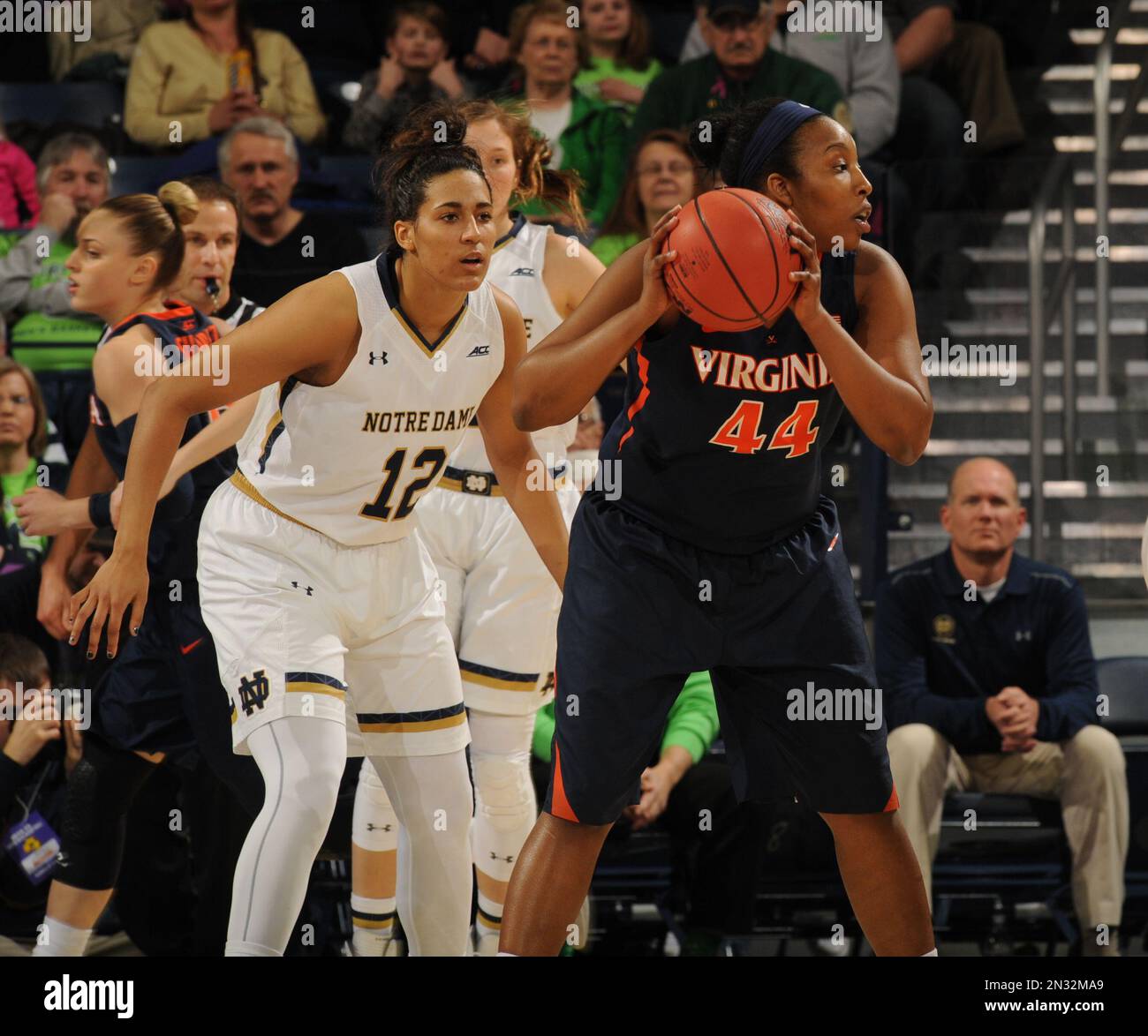 Virginia center Sydney Umeri, right, as Notre Dame forward Taya Reimer ...